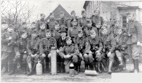 Bruno Tesch Hat Poses With Soldiers Holding His Products In Warsaw He Was One Of Many