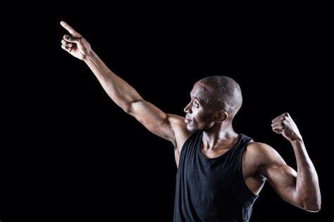 Premium Photo Muscular Man Pointing While Standing