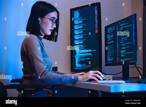 Asian Woman Software Development Working On Coding Computer Screen And Flowchart At Night In