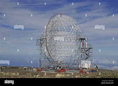 A Large Telescope With A Metal Structure Under A Blue Sky No Light