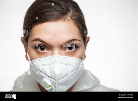 Female Caucasian Medical Worker Wearing Ppe N95 Face Mask And Protective Suitcloseup Portrait