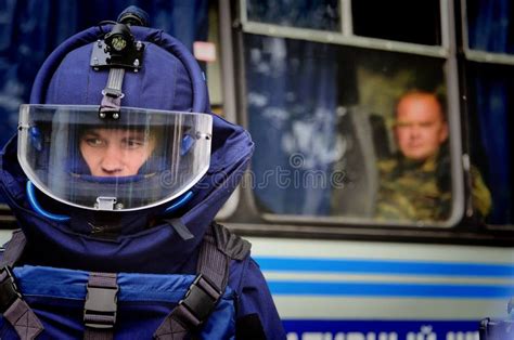 A Minesweeper In A Protective Suit Is Preparing To Clear A Mine During An Exercise Editorial
