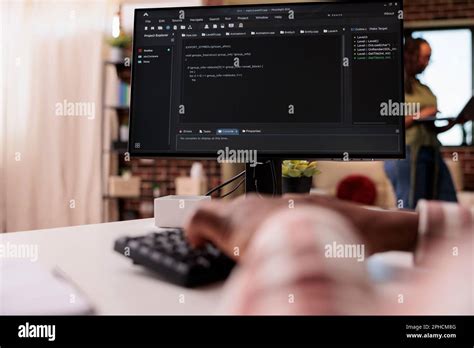 Closeup Of African American Programmer Writing Code On Personal Computer Typing Keyboard While
