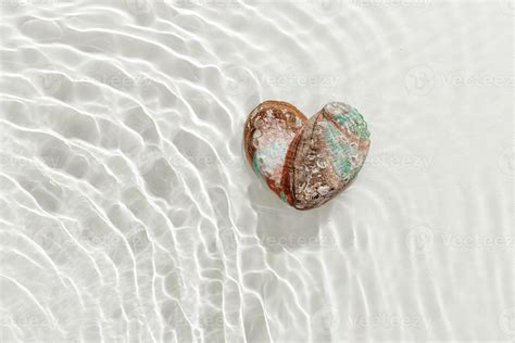 Shiny Shells Of Abalone As Heart With Waves Sea Water Textured Background Closeup Seashell With