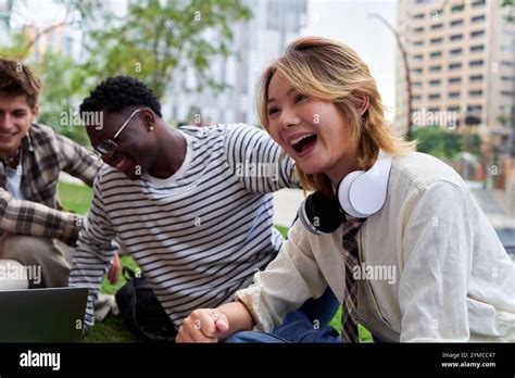 Chinese Female Student Gathering With Friends After Class Laughing