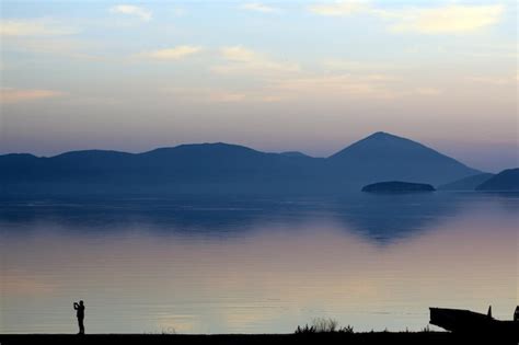 Premium Photo Pisture Of A Men Picturing Lake Prespa In Macedonia On