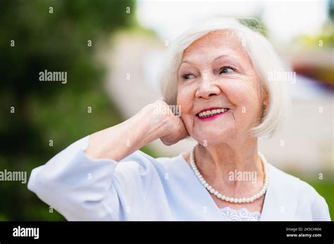 Beautiful Senior Old Woman With Silver Hair Portrait Outdoors Stock