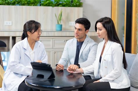Premium Photo Doctor And Patient Meeting Female Doctor Using Digital
