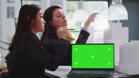 Asian It Engineers Analyzing Greenscreen On Computer And Coding