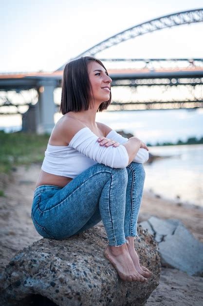 Premium Photo Girl Walking On The Beach Against The Sunset