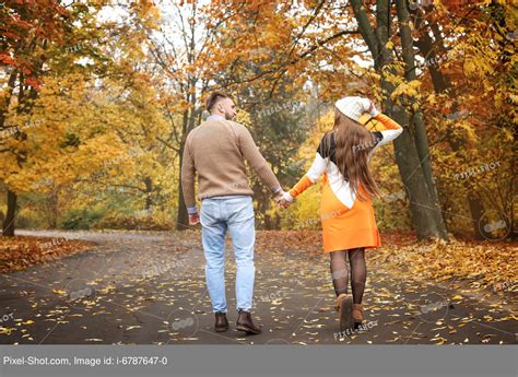 Couple Walking In Park