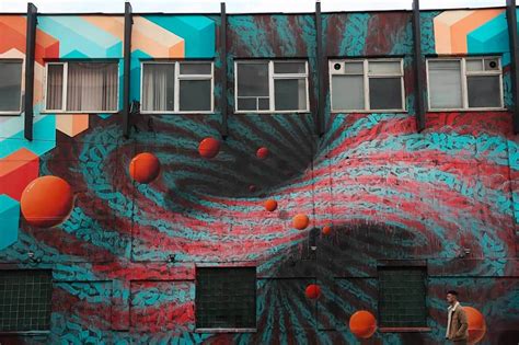 Izzy Izvne Turns Buildings Intro Portals With Her Calligraphy Murals