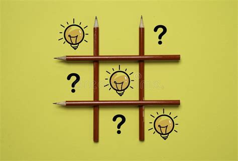 Glowing Drawing Lightbulb And Question Mark On Tic Tac Toe Table For