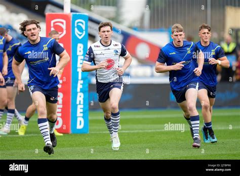 Rob Mulhern 19 Adam Holroyd And Matty Nicholson Of Warrington Wolves Warm Up Before The Match