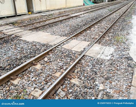 The Concrete Block Pathway For Crossing The Railway Track Between The Platform Royalty Free