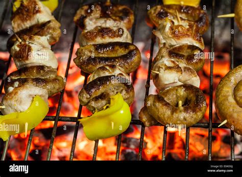 Different Types Of Meat Cooking Outside On A Barbecue Stock Photo Alamy