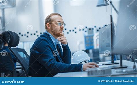 Shot Of Male Industrial Engineer Solving Problems Working On A