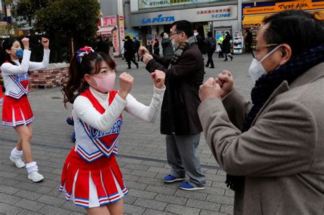 Japanese Cheerleaders Perform Outside Rail Station To Lift Spirits Amid