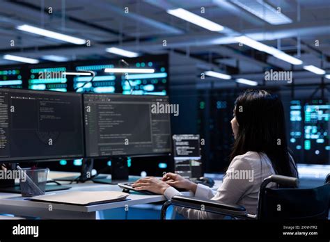 Person With Paraplegia Working In Inclusive Server Farm Facility Doing Maintenance Job