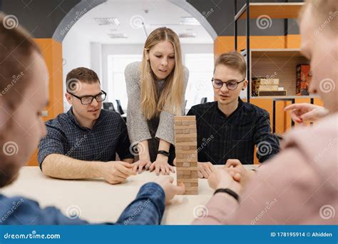 Mixed Team Of Programmers Analyzing Source Code Looking At Green Screen