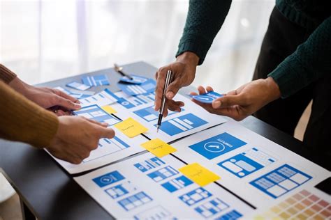 Premium Photo Ux Developer And Ui Designer Brainstorming About Mobile
