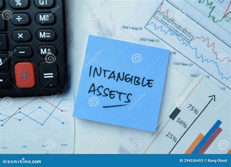 Concept Of Intangible Assets Write On Sticky Notes Isolated On Wooden Table Stock Image Image