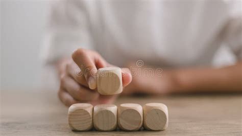 Businesswomen Stack Blank Wooden Cubes On The Table With Copy Space