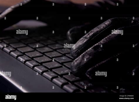 Hacker S Hands On Laptop Keyboard Hacking A Security System Hacker In Gloves Stock Photo Alamy