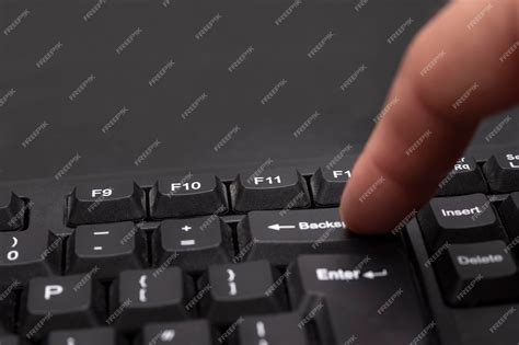 Premium Photo Backspace Button On Computer Keyboard Finger Presses A
