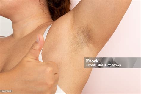Closeup Of Unshaven Female Armpit Hair On Womans Hands Concept Of Body