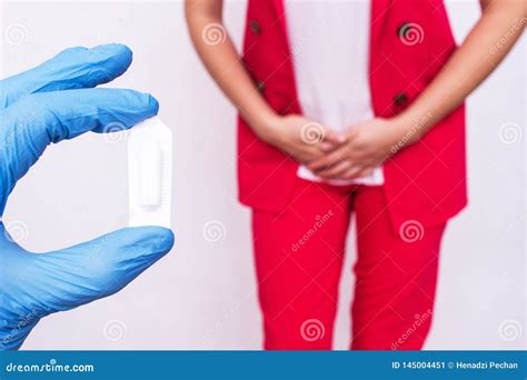 Doctor Holds Vaginal Suppository Suppository Against The Background Of