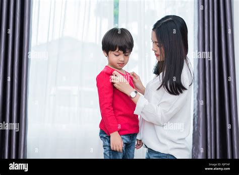 Young Asian Mom Dressed Up Son Shirt For Preparing Go To School Mother