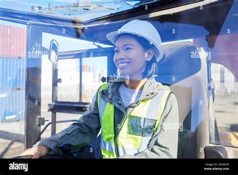 Logistics Supply Chain And Transport With A Woman Shipping Worker Driving A Vehicle On A