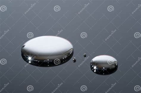 Droplets of Mercury on a Reflective Surface Stock Photo - Image of poisonous, surface: 22483022