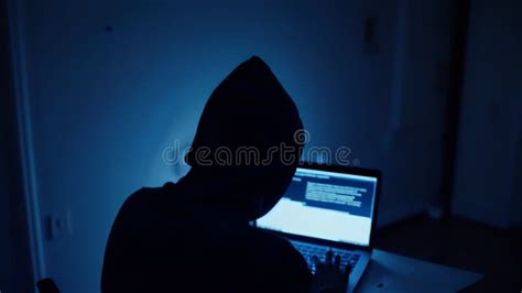 Hacker Hacks Programs Computer Scammer Programmers Working Intently On Laptop Typing In Dark