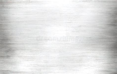 A Textured Metallic Surface With A Brushed Finish Reflecting Soft Light