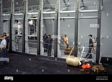 Crew Members Aboard The Nuclear Powered Aircraft Carrier Uss Abraham