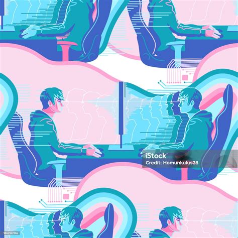 two guys sitting in front of each other separated by the computer