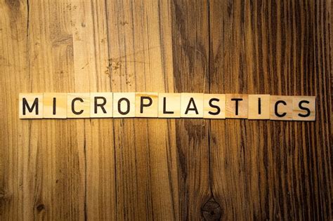 Premium Photo Microplastics Concept Word In Wooden Letters On Dark