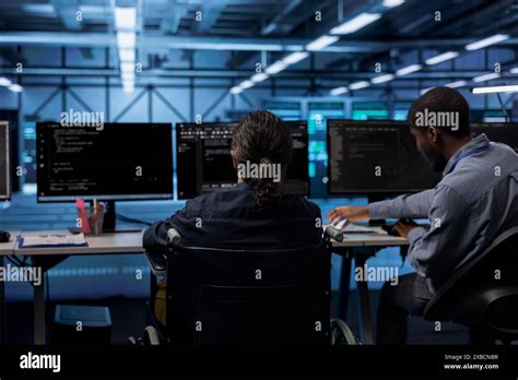 Person With Paraplegia Working In Inclusive Workplace Typing Data On Pc Doing Needed