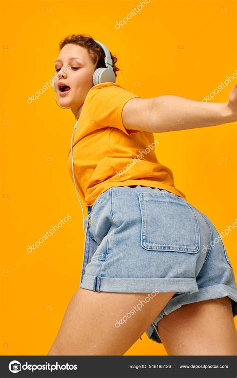 Pretty Girl Wearing Headphones Denim Shorts Close Up Emotions Lifestyle Unaltered Stock Photo