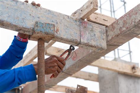 Workers Use Scaffolding Wire To Support The Floor Pouring Concrete Workers Use Scaffolding Wire To Support The Floor Pouring Concrete
