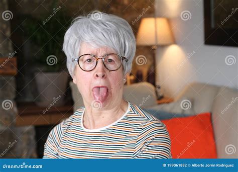 Senior Woman Sticking Out Tongue Stock Photo Image Of Playful Person