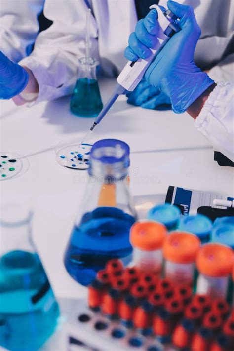 Chemists In A Lab Developing Cosmetic Products Testing And Analyzing