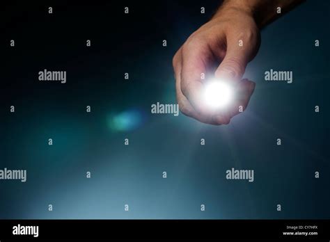 Man Pointing A Led Flashlight Towards Camera Stock Photo Alamy