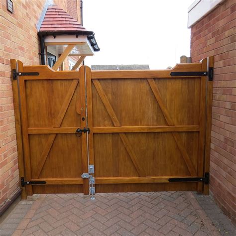 Unequally Split Nannerch Gunstock Driveway Gates Red Wooden Driveway
