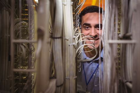 Premium Photo Portrait Of Technician Analyzing Server