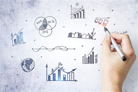 Premium Photo Businessman Hand Drawing Charts And Graphs On Concrete Wall