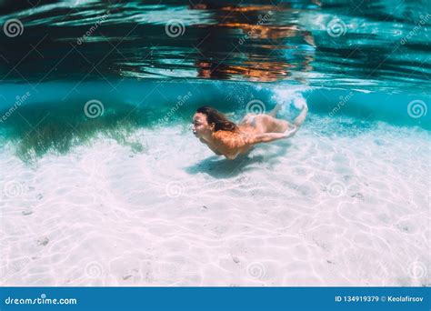 Attractive Nude Woman Swimming In Tropical Ocean Underwater Photo