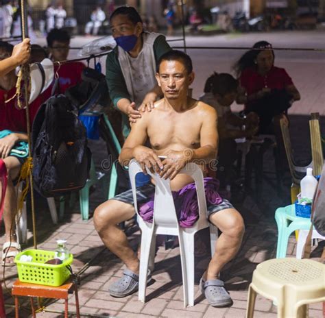 Local Filipino Man Receives Shoulder Massage Treatmentalong The
